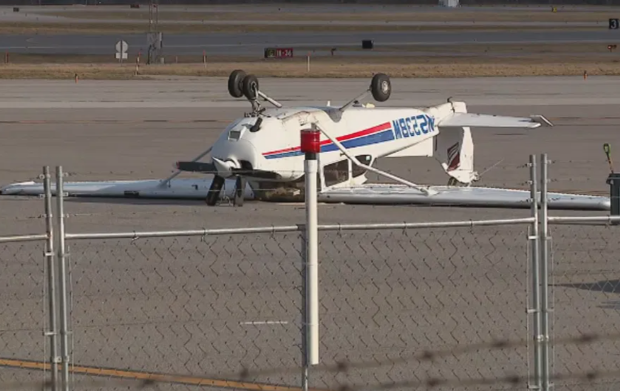 Small, unoccupied plane flipped upside down by wind gust at Portland ...